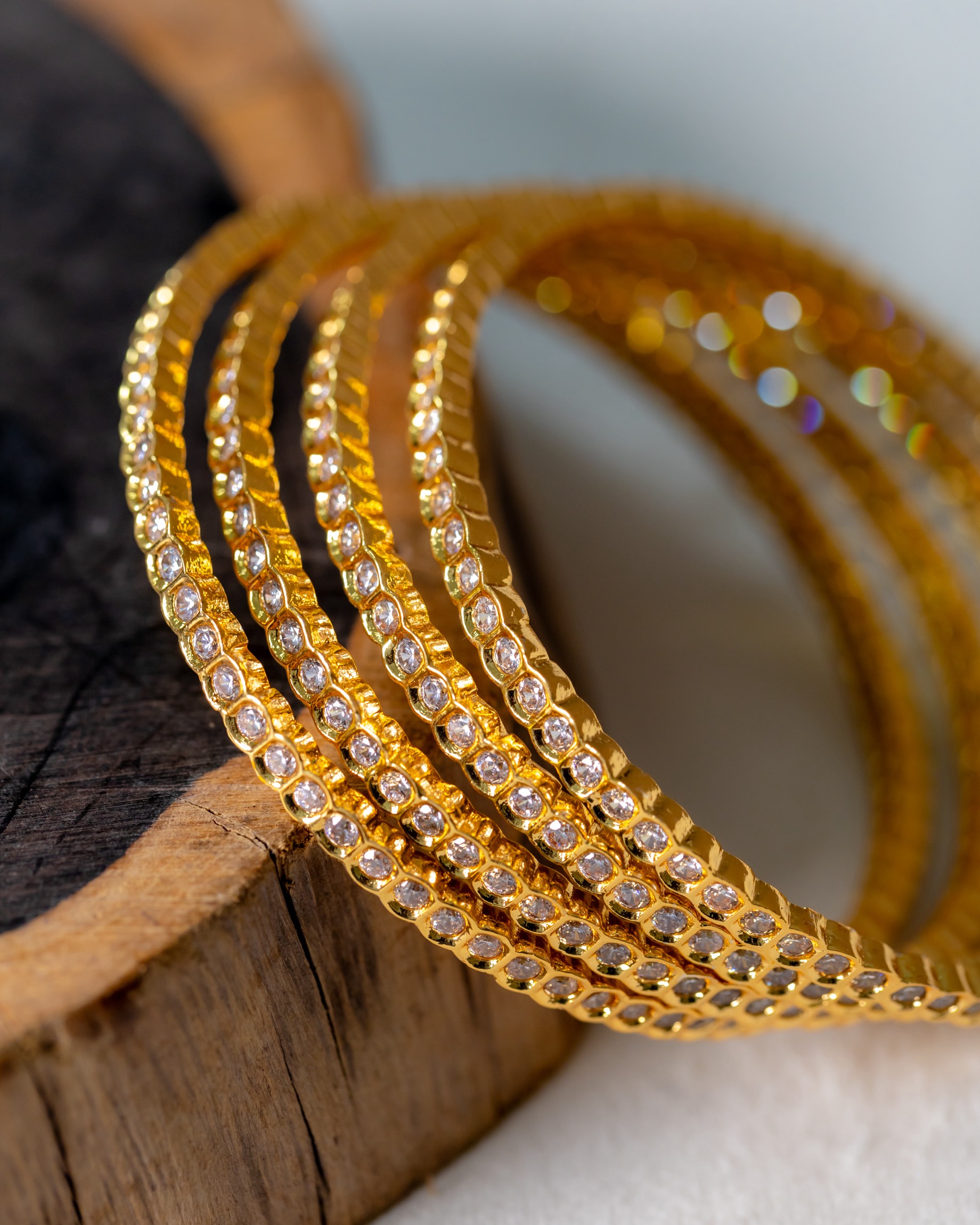 Leela White Stone Studded Gold Bangle Set